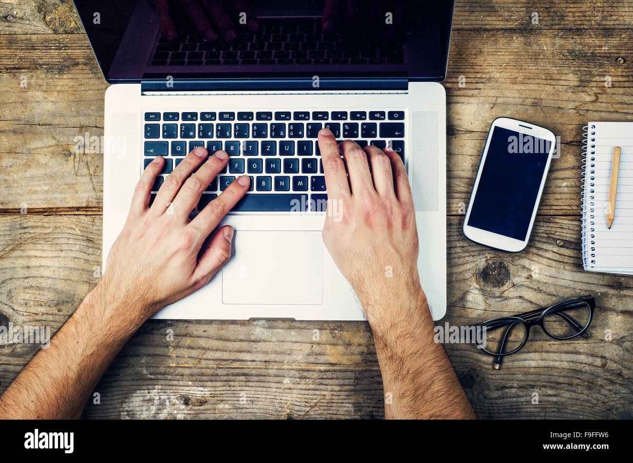 Desktop mix on a wooden office table background. View from above Stock ...