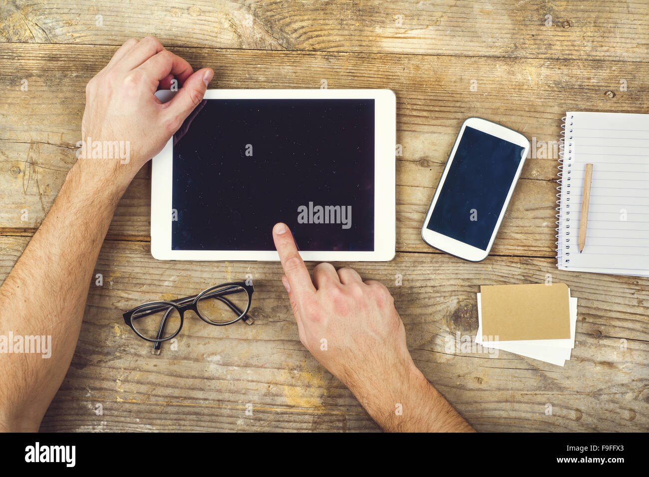 Desktop mix on a wooden office table background. View from above Stock ...