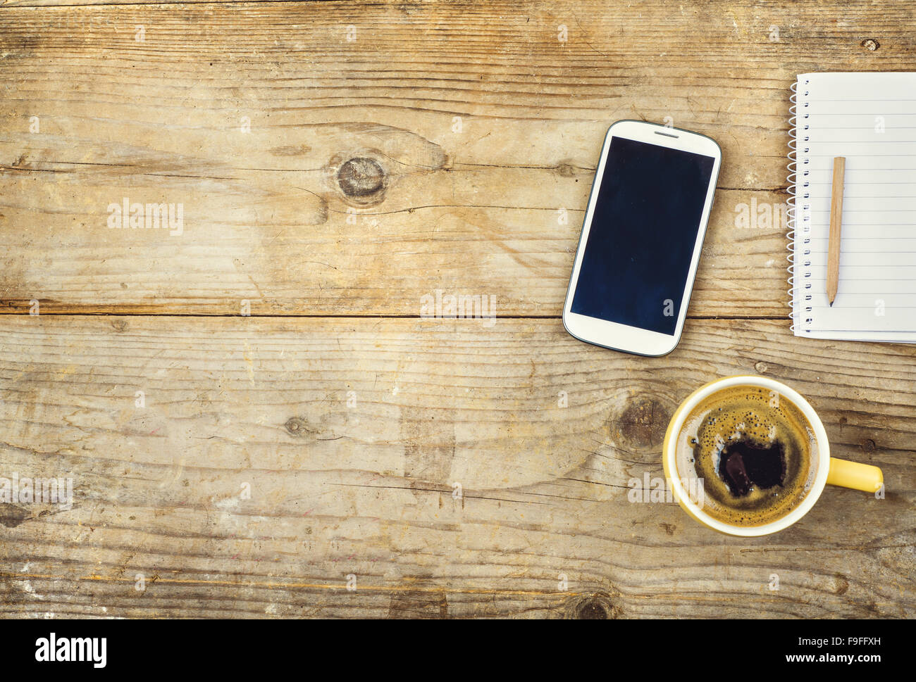 Desktop mix on a wooden office table background. View from above Stock ...