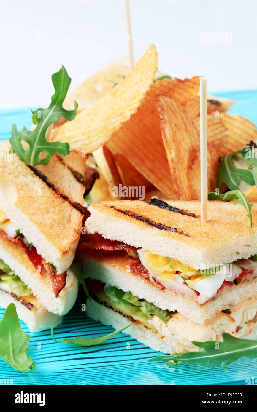 Club sandwiches and crisps Stock Photo - Alamy