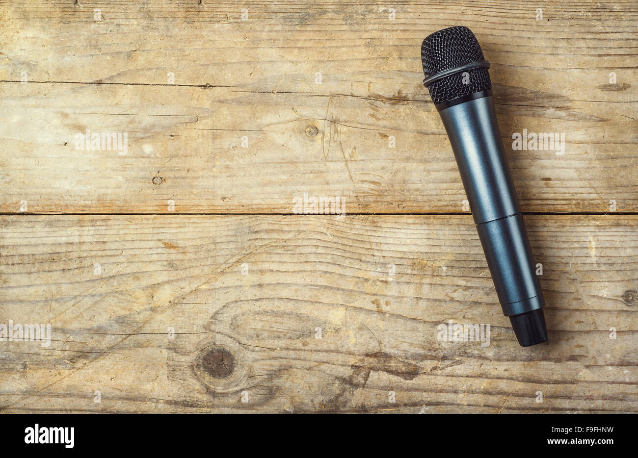 Microphone on a wooden office desk background. View from above Stock ...