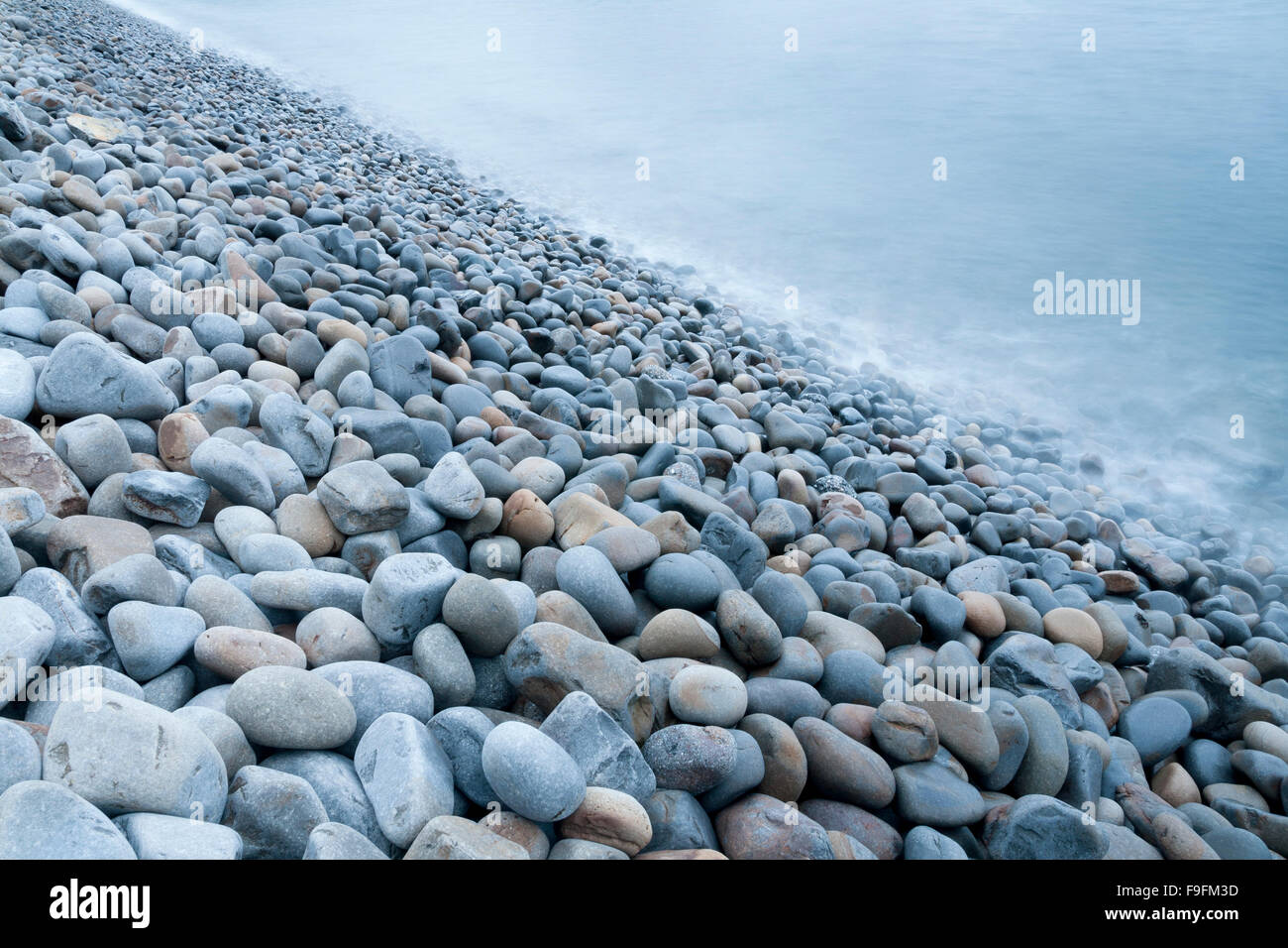 Shore of soft stones Stock Photo - Alamy