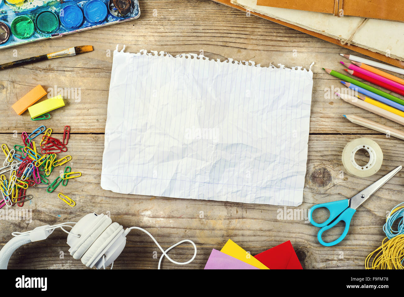 Desk of an artist with lots of stationery objects. Studio shot on ...