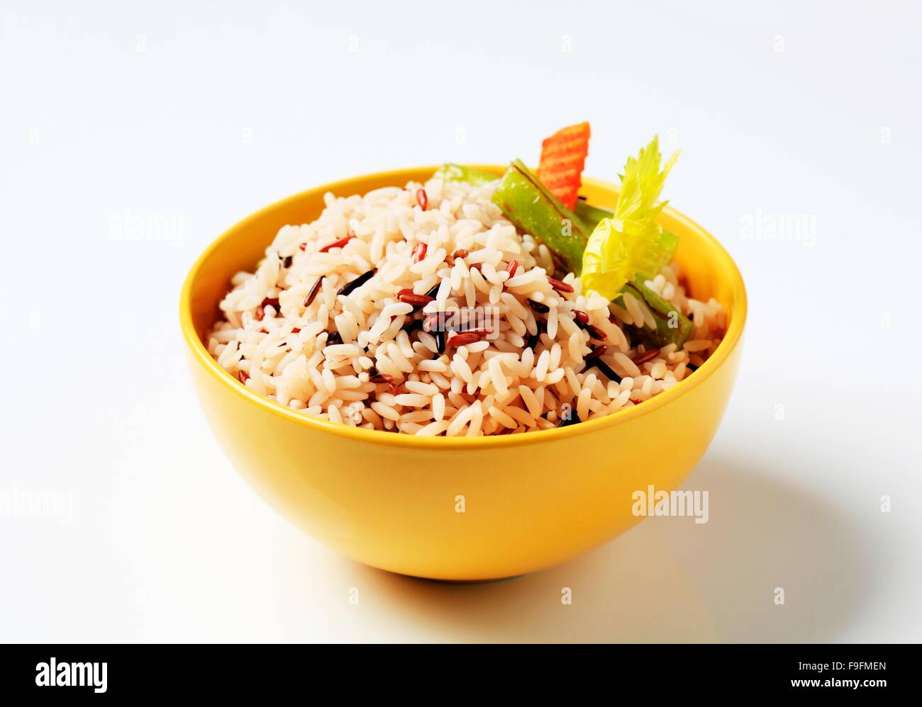 Bowl of cooked mixed rice - studio Stock Photo - Alamy