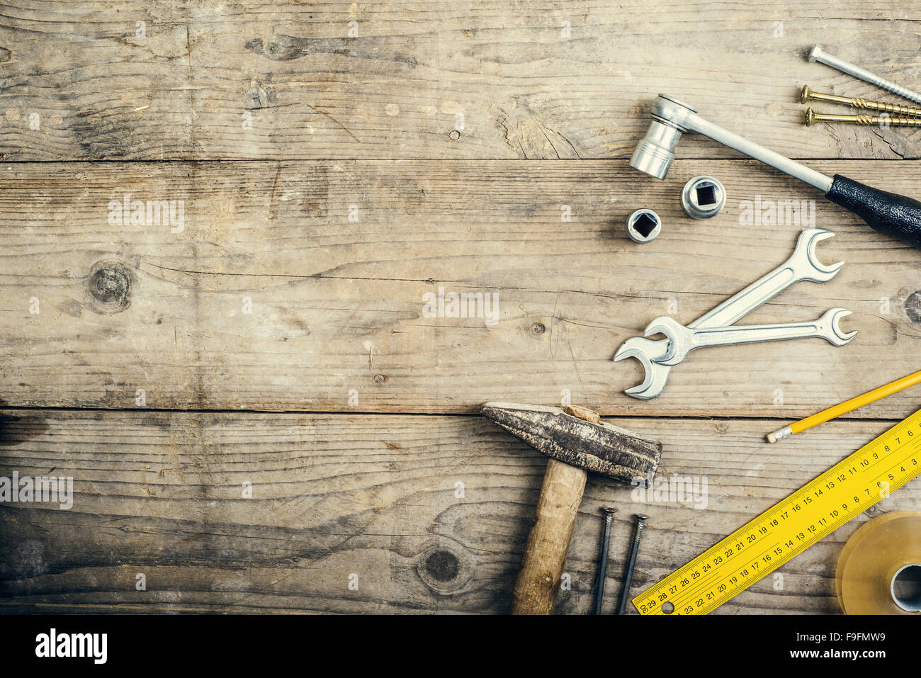 Desk of a carpenter with different tools. Studio shot on a wooden ...