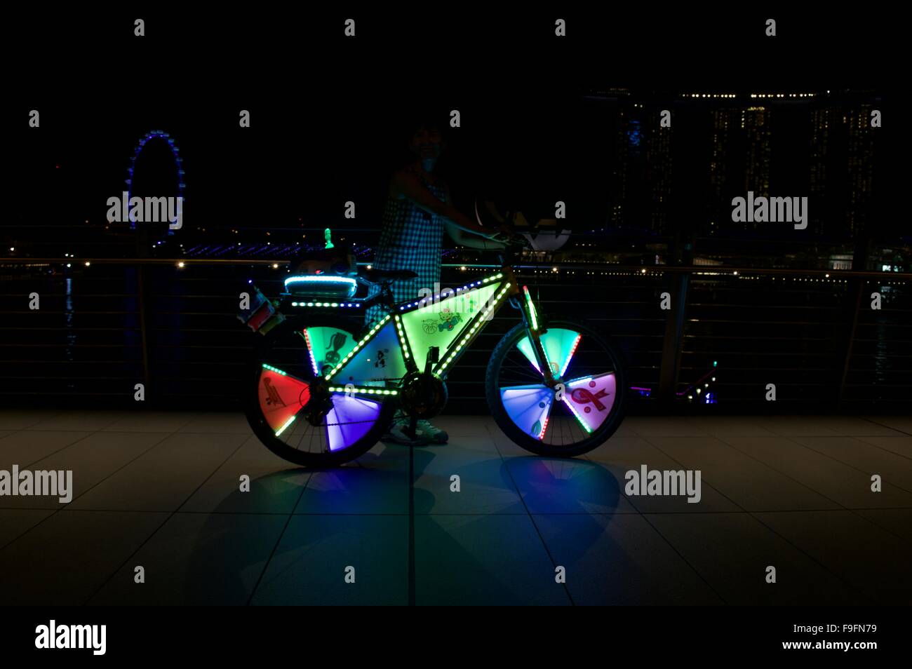 LED illuminating bicycle at Marina bay singapore. The cycle was self ...
