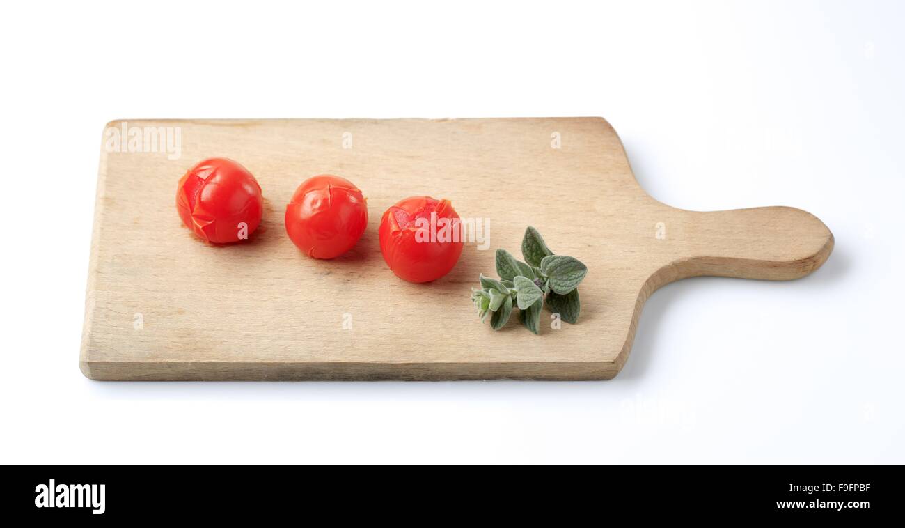 Red tomatoes ready to be peeled - studio Stock Photo - Alamy