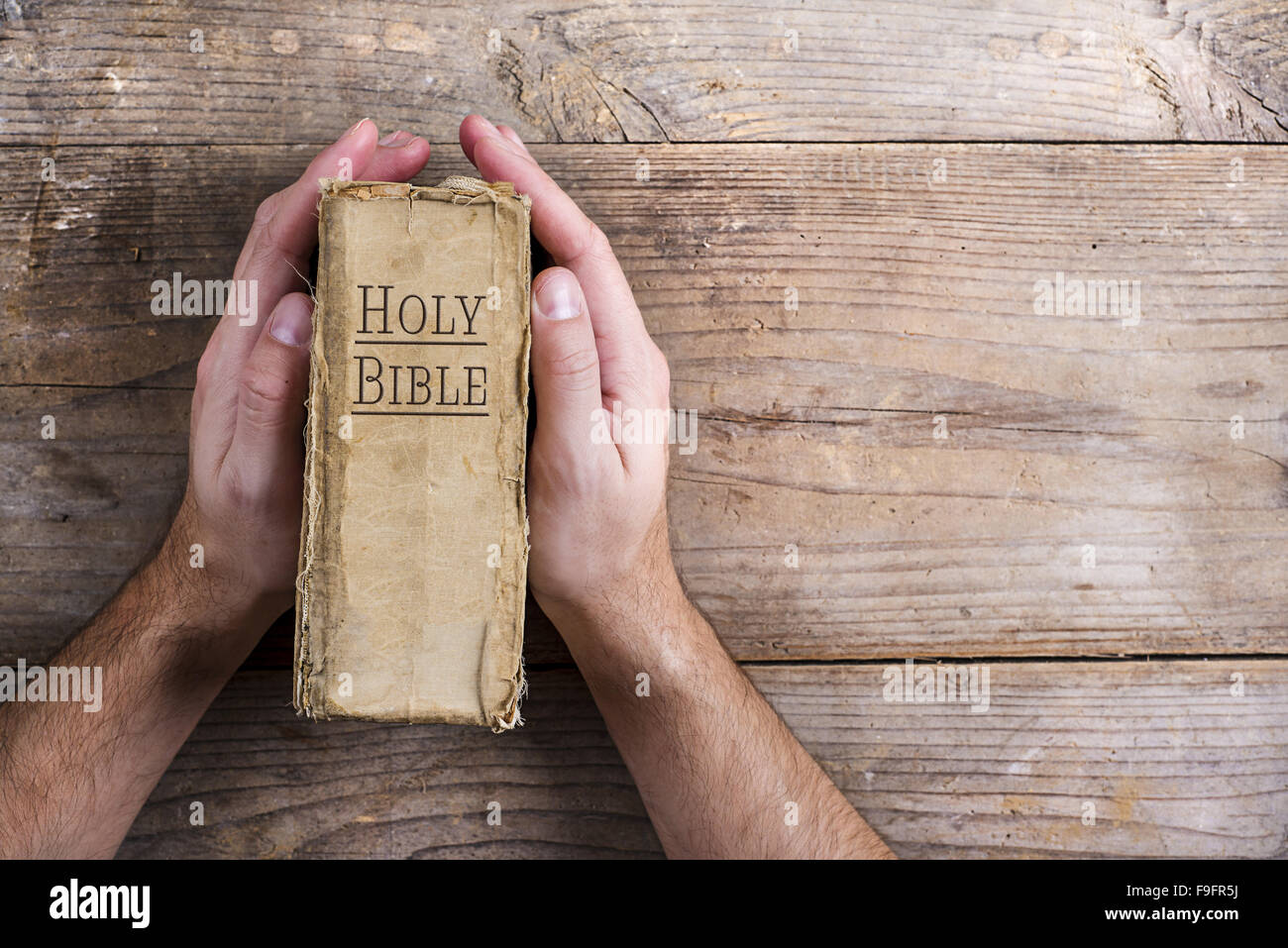 Praying Hands With Bible Background