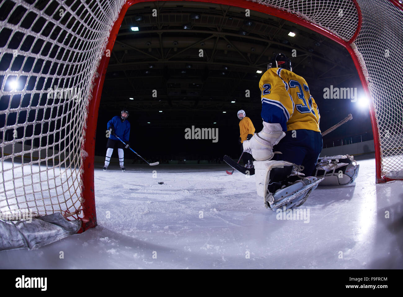 ice hockey goalkeeper player on goal in action Stock Photo - Alamy