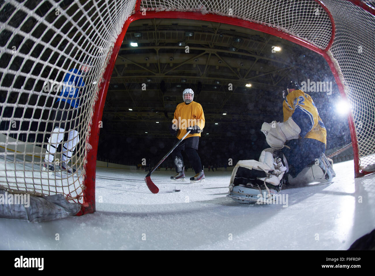 ice hockey goalkeeper player on goal in action Stock Photo - Alamy