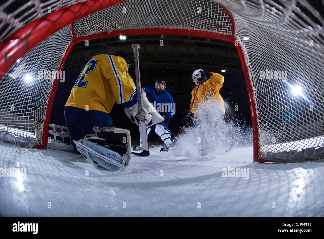 ice hockey goalkeeper player on goal in action Stock Photo - Alamy