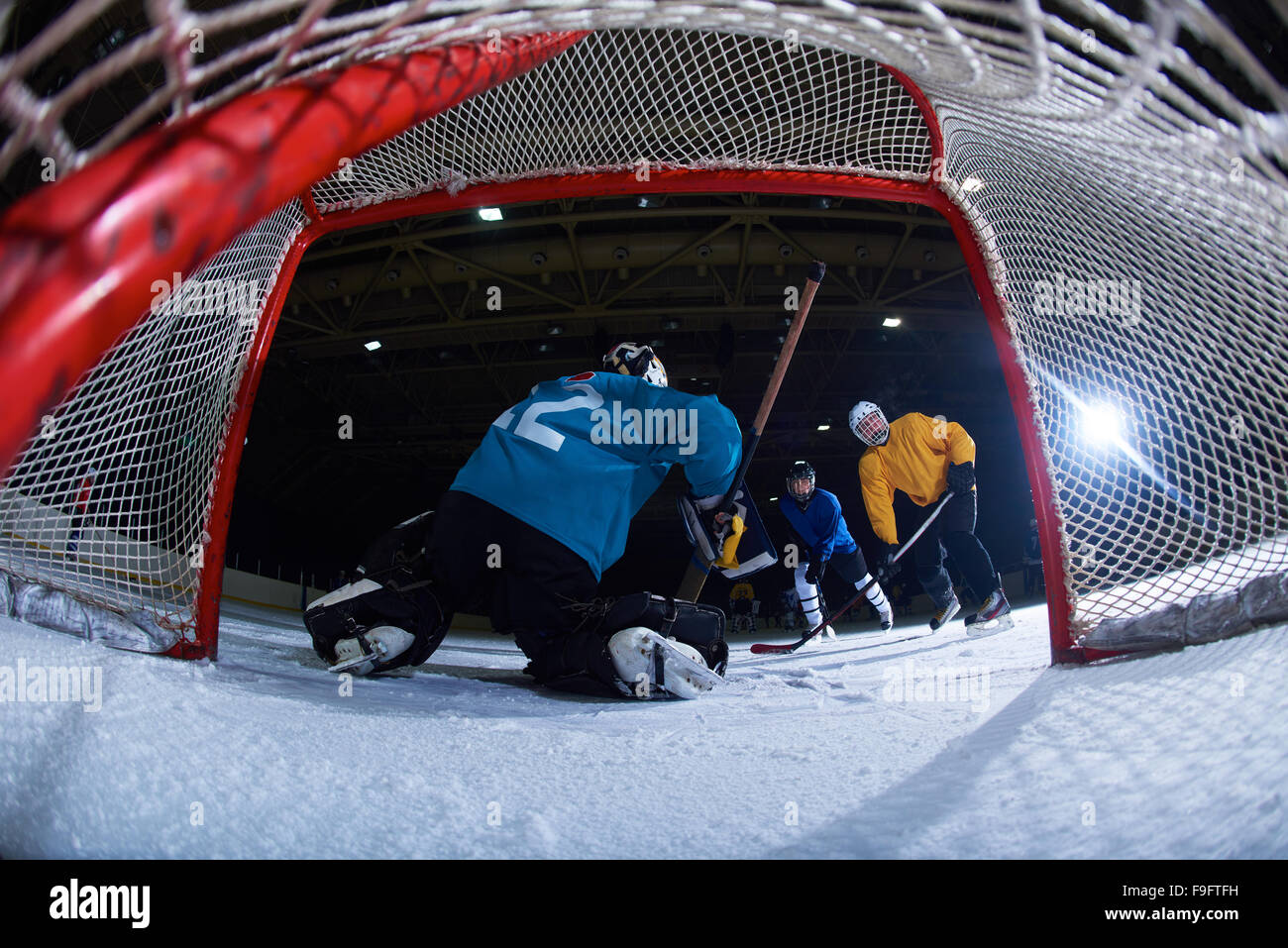 ice hockey goalkeeper player on goal in action Stock Photo - Alamy