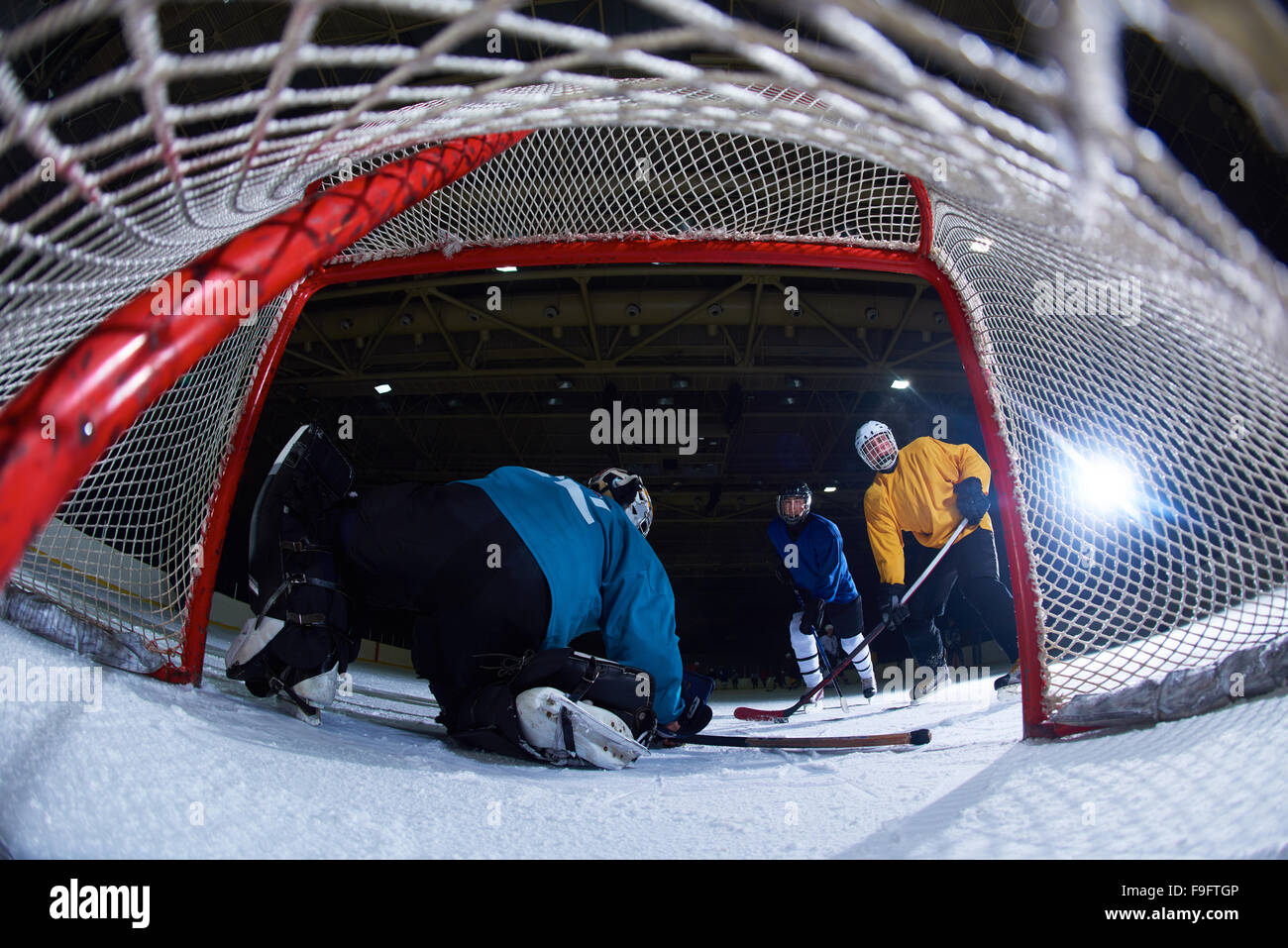 ice hockey goalkeeper player on goal in action Stock Photo - Alamy
