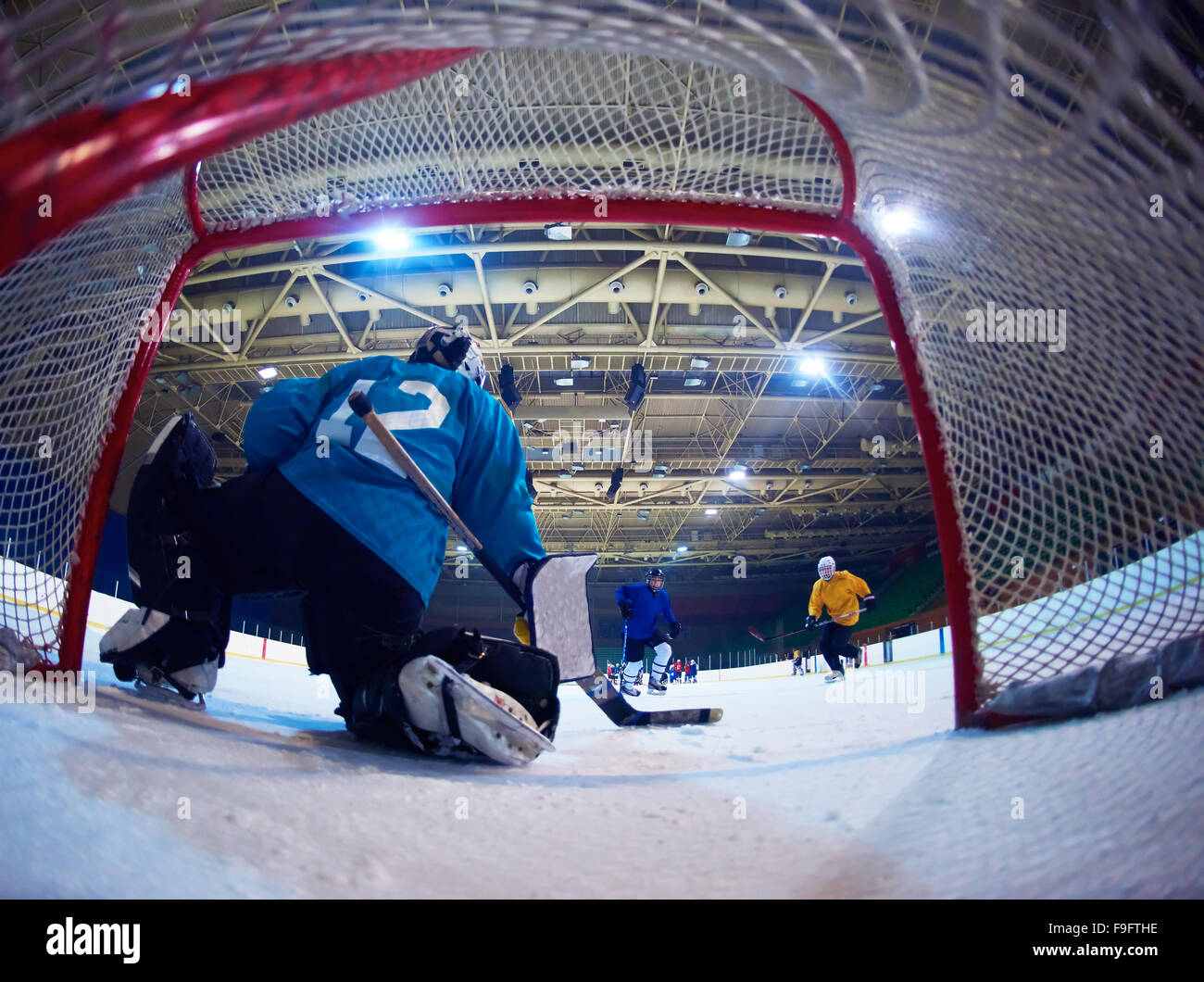 ice hockey goalkeeper player on goal in action Stock Photo - Alamy