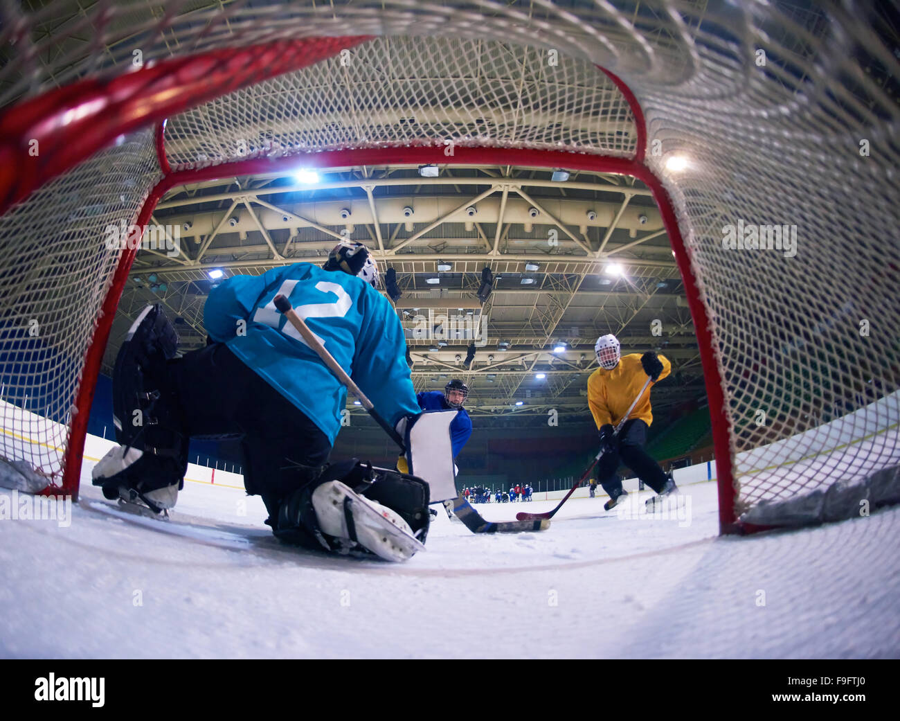 ice hockey goalkeeper player on goal in action Stock Photo - Alamy