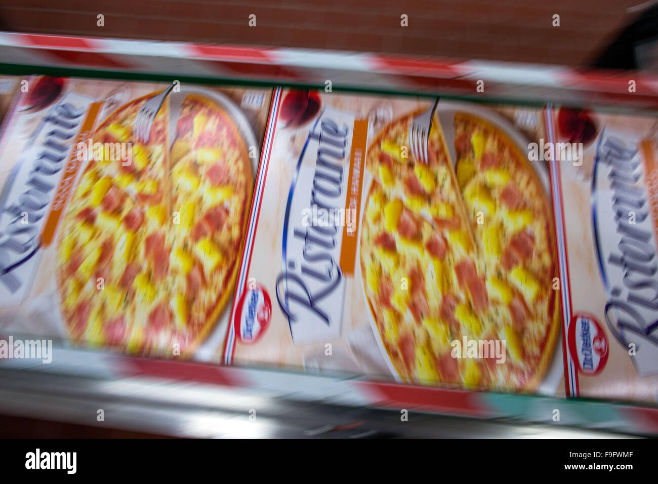 A production line of packaged frozen pizzas at the pizza factory of ...