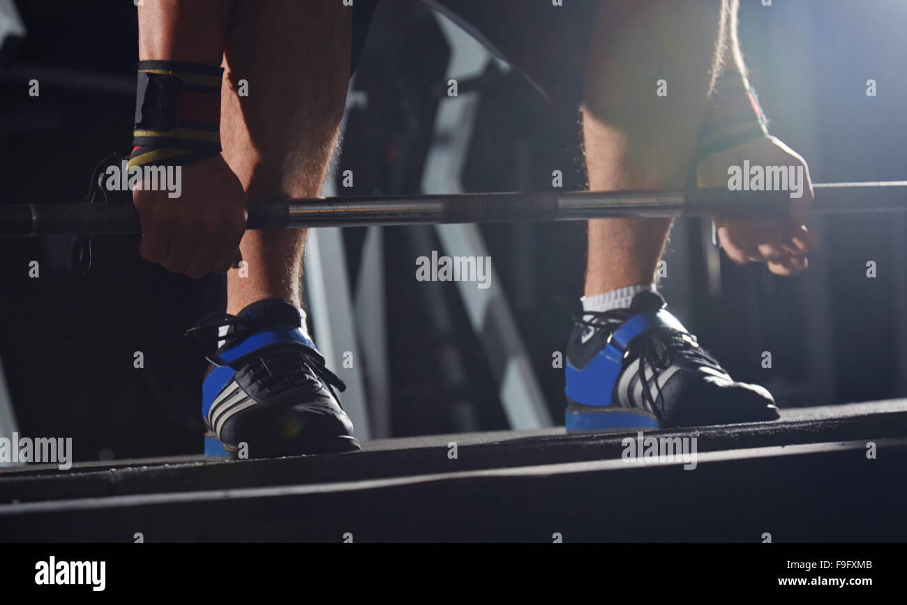Hands of man ready to lift barbell at fitness club Stock Photo - Alamy