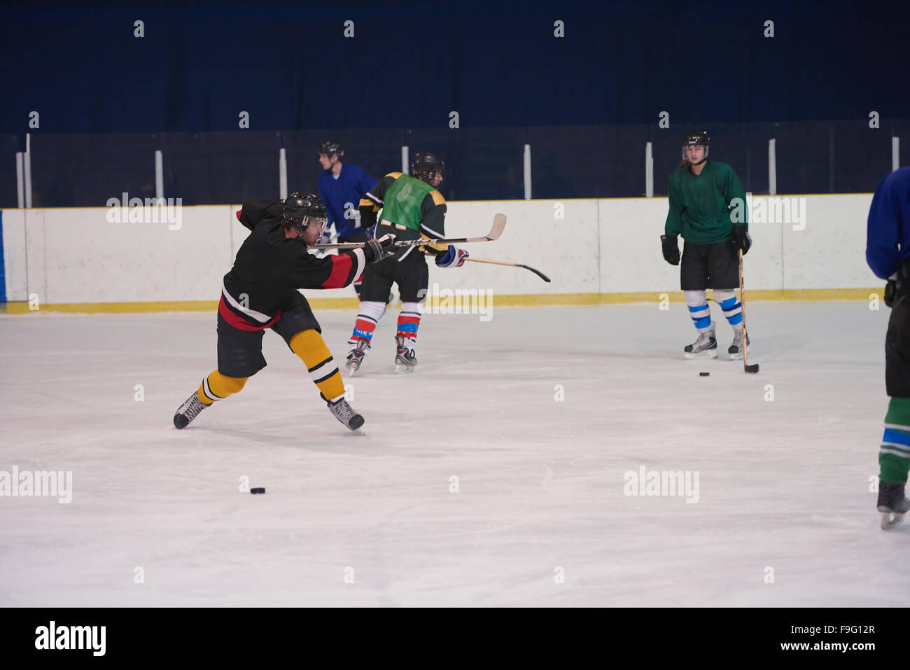 ice hockey player in action kicking with stick Stock Photo - Alamy