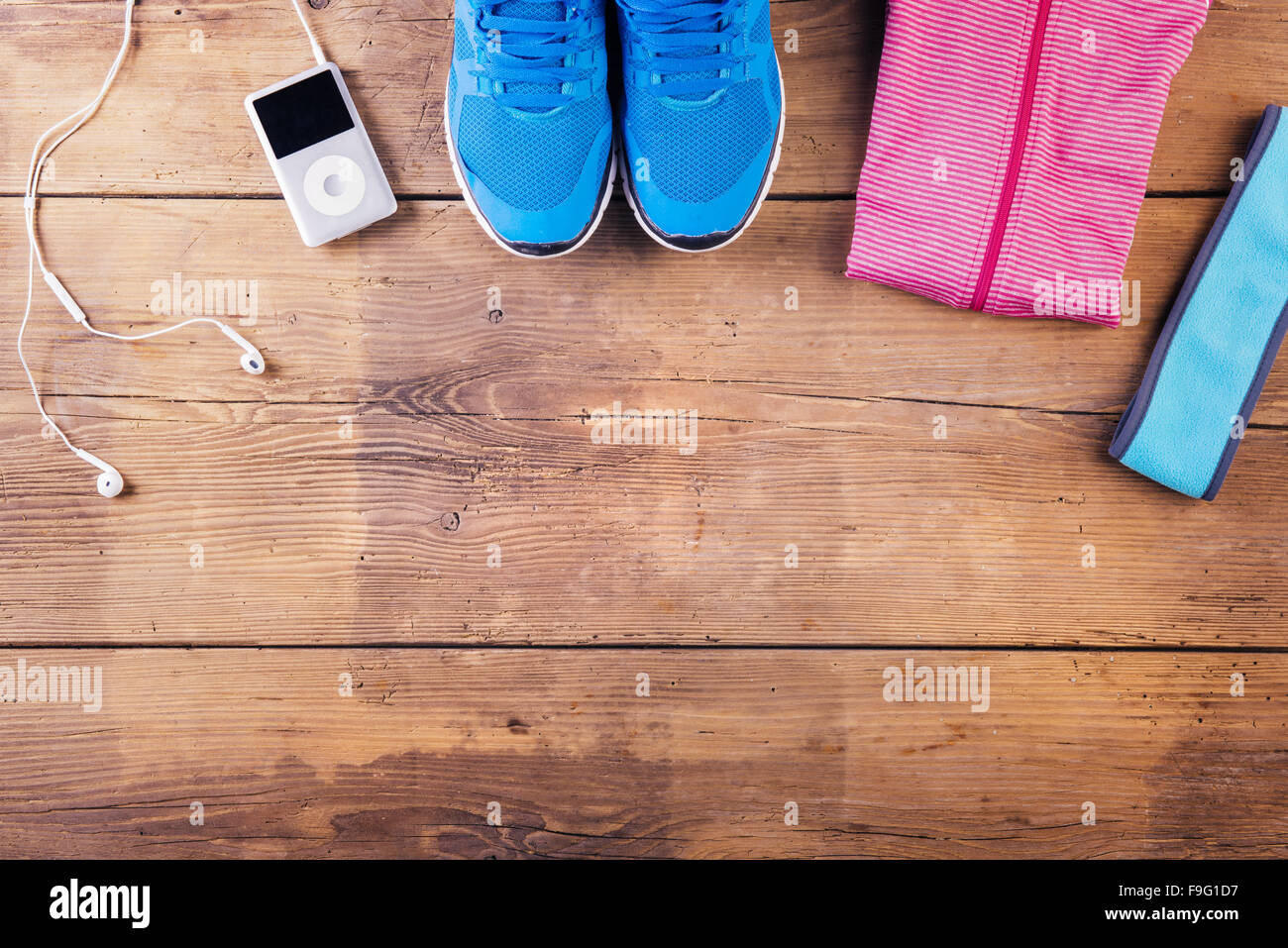Various running stuff lined up on a wooden floor background Stock Photo ...