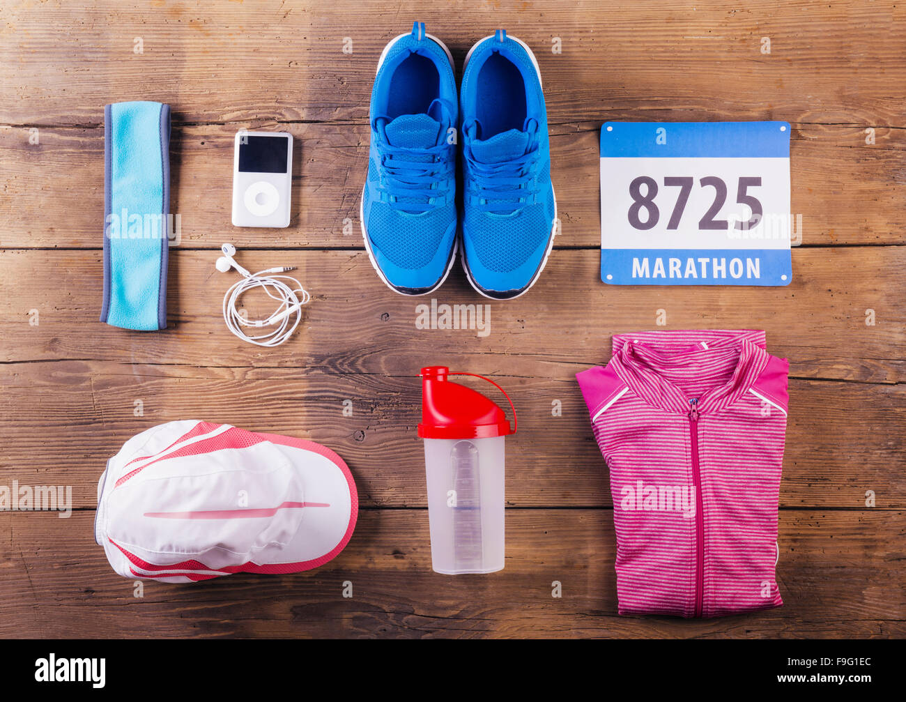 Various running stuff lined up on a wooden floor background Stock Photo ...