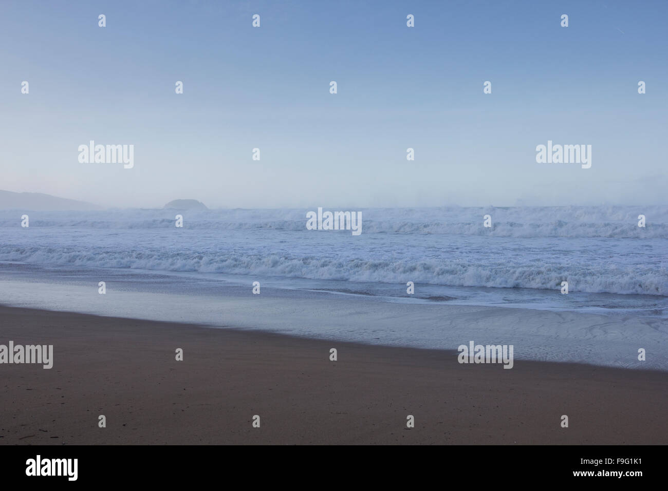 Beach with surge Stock Photo - Alamy