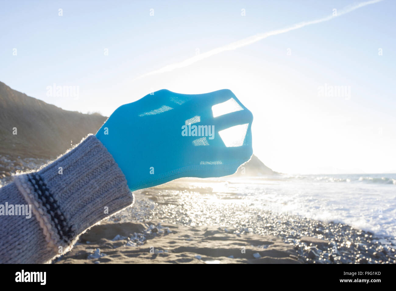 Blue hand on the beach Stock Photo - Alamy