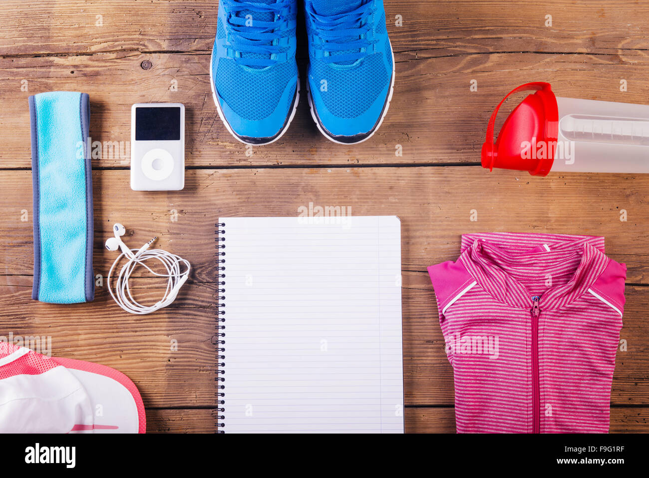 Various running stuff lined up on a wooden floor background Stock Photo ...