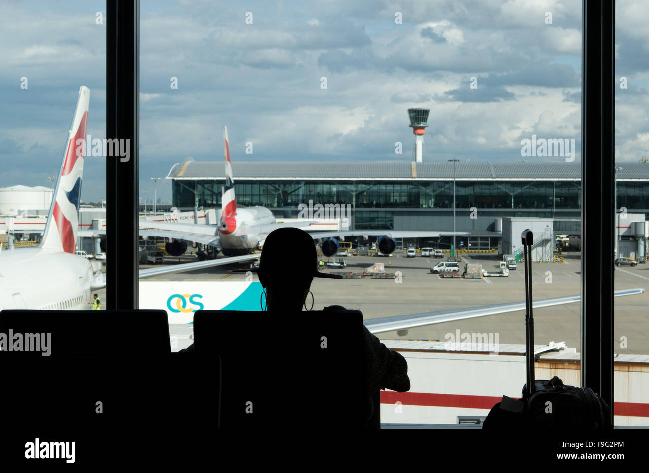 Silhouette of a female passenger sitting by the window. travel ...