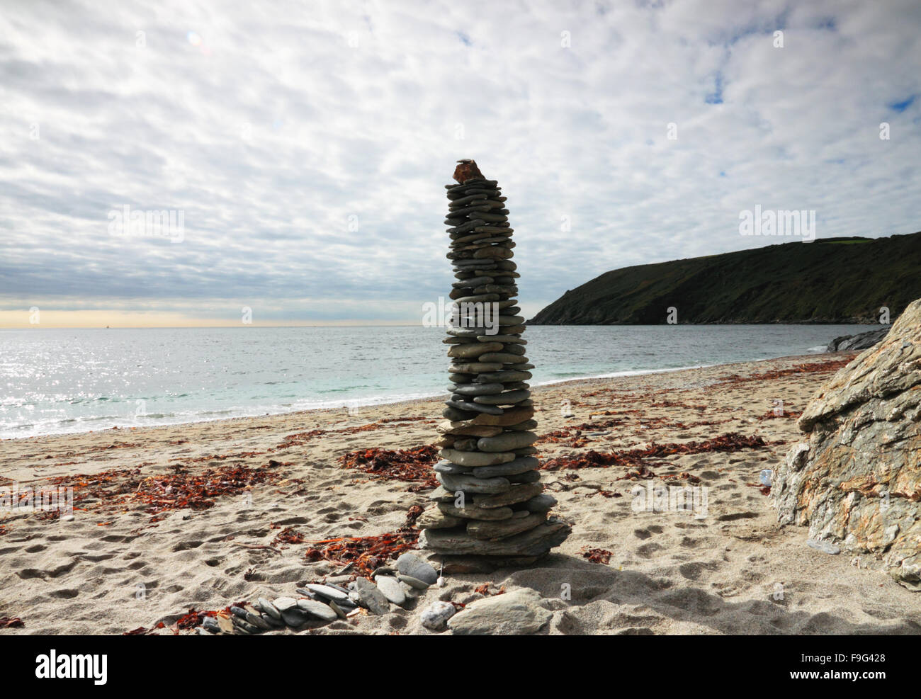 Stone sculpture on Vault Beach, with the Dodman in the distance ...
