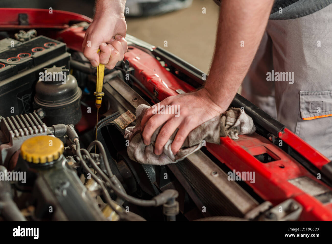 Checking for engine oil on a car Stock Photo - Alamy
