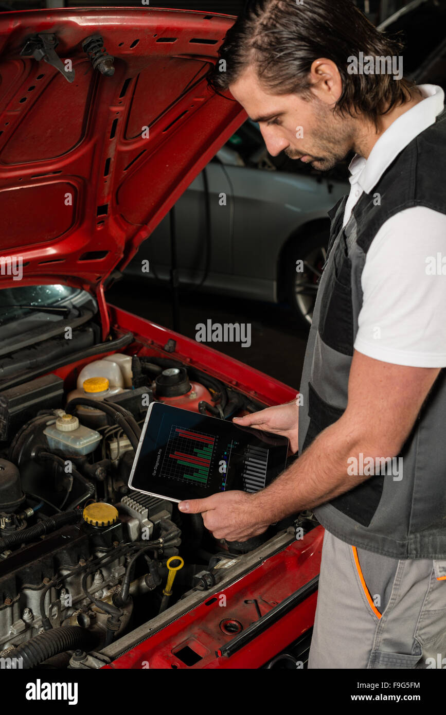 Mechanic garage tablet hi-res stock photography and images - Alamy