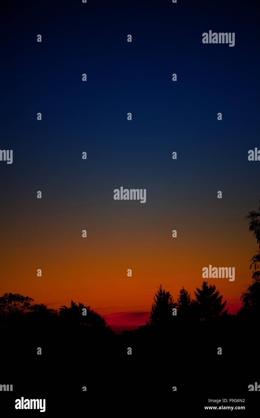 Calming red dusk sky, sunset dark trees silhouette in Poland, Europe ...