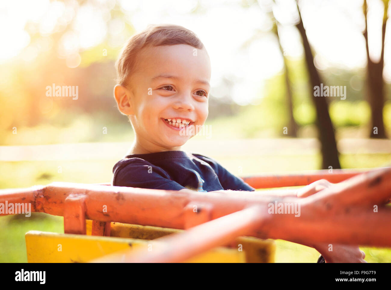 Cute little boy having fun on playground Stock Photo - Alamy