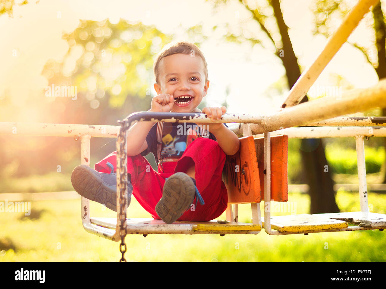 Cute little boy having fun on playground Stock Photo - Alamy