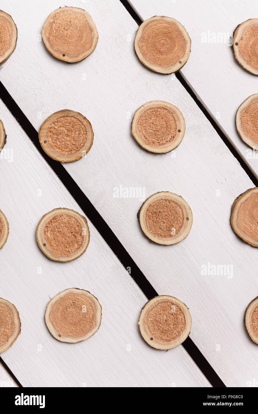 Wooden slices texture on white table Stock Photo - Alamy