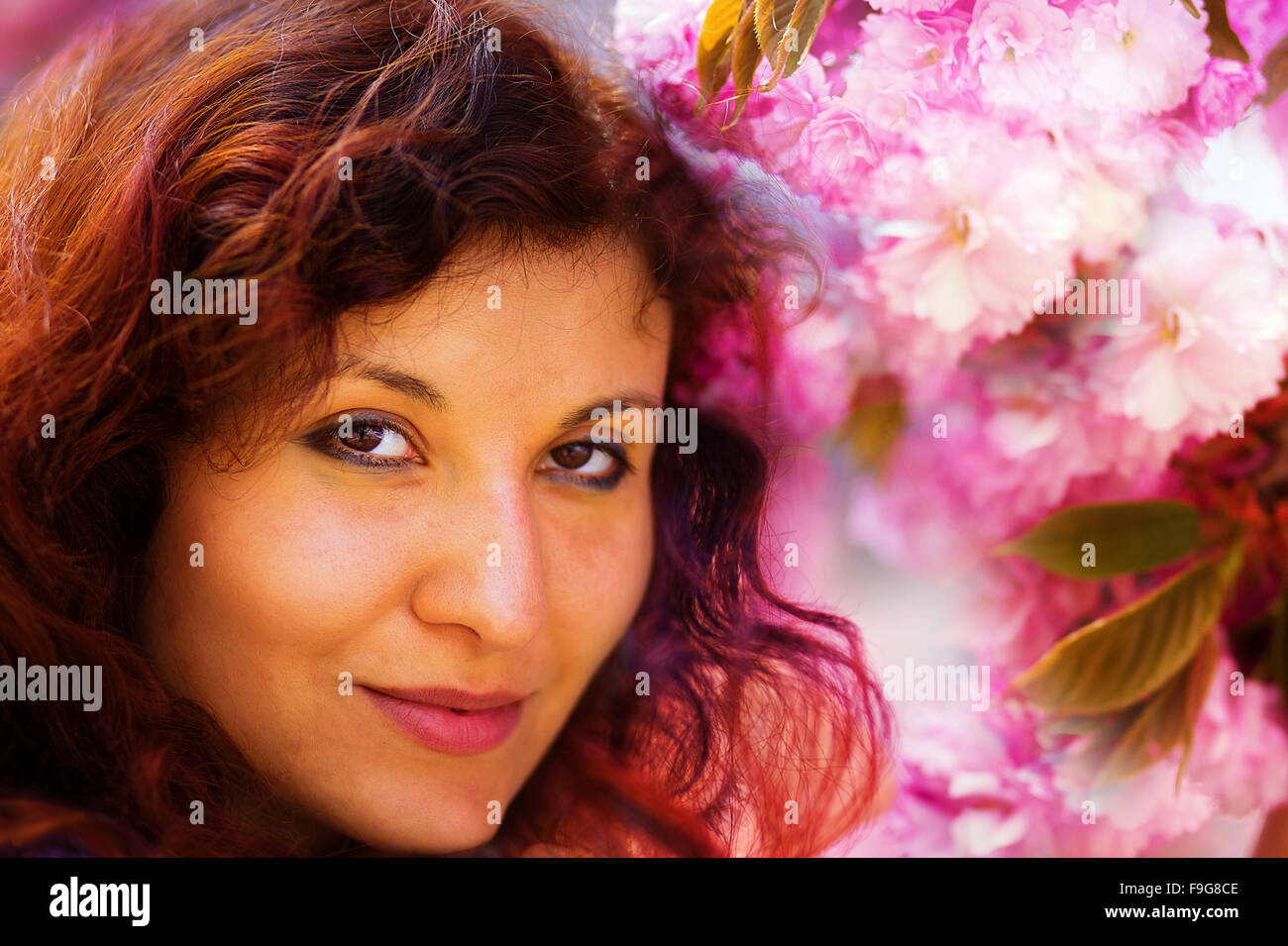 Beautiful Girl with flowers, Spring Magic. Sakura pink flowers Stock ...