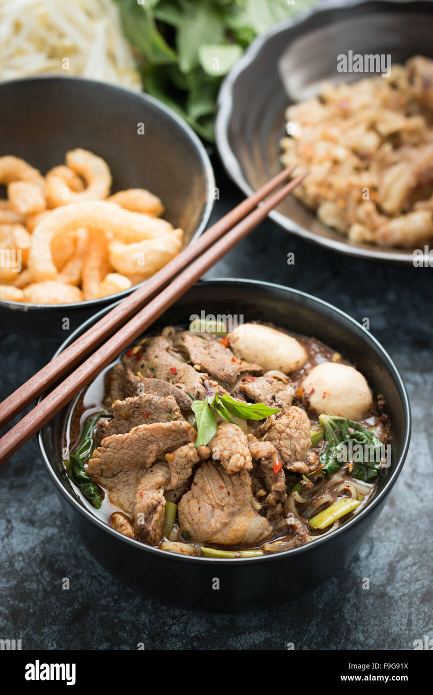 spicy thai pork noodle, boat Noodle, "Kuay Tiew Rua" with pork rind and ...