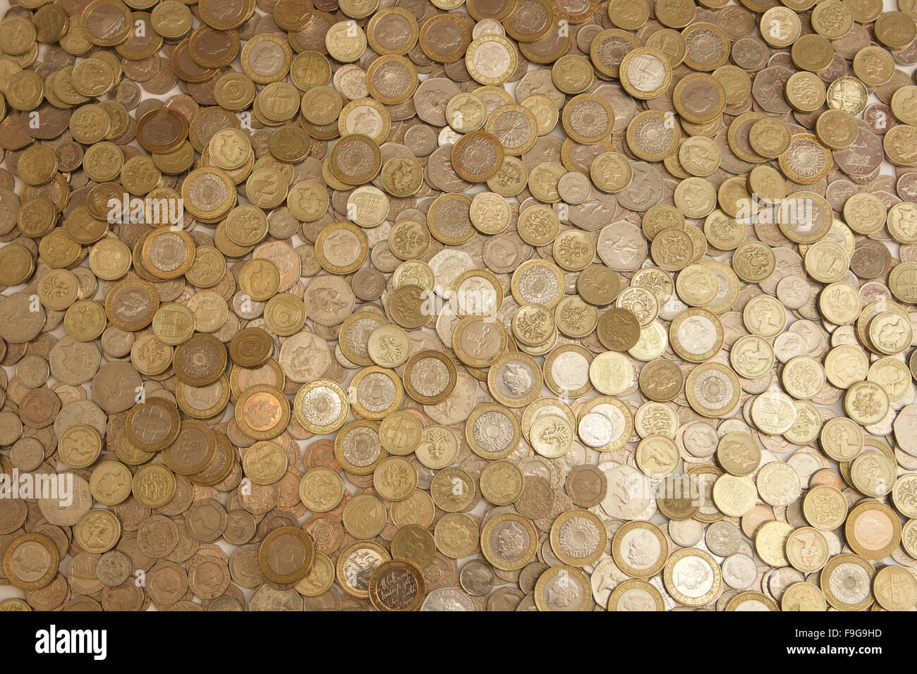Overhead shot of UK coins laid out. Including £1, £2, 50,20,50,10,5p ...