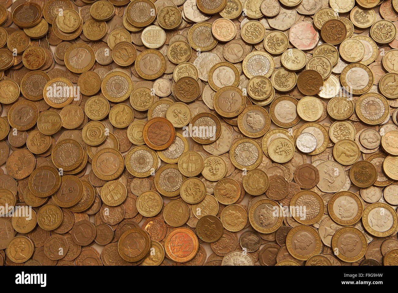 Overhead shot of UK coins laid out. Including £1, £2, 50,20,50,10,5p ...