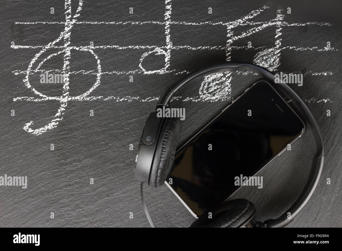 Music notes with headphones Stock Photo - Alamy