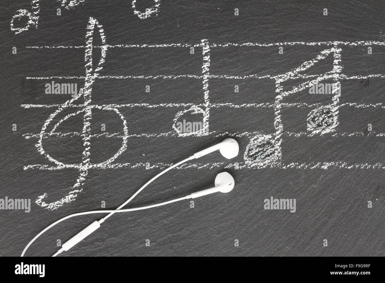 Music notes with headphones Stock Photo - Alamy