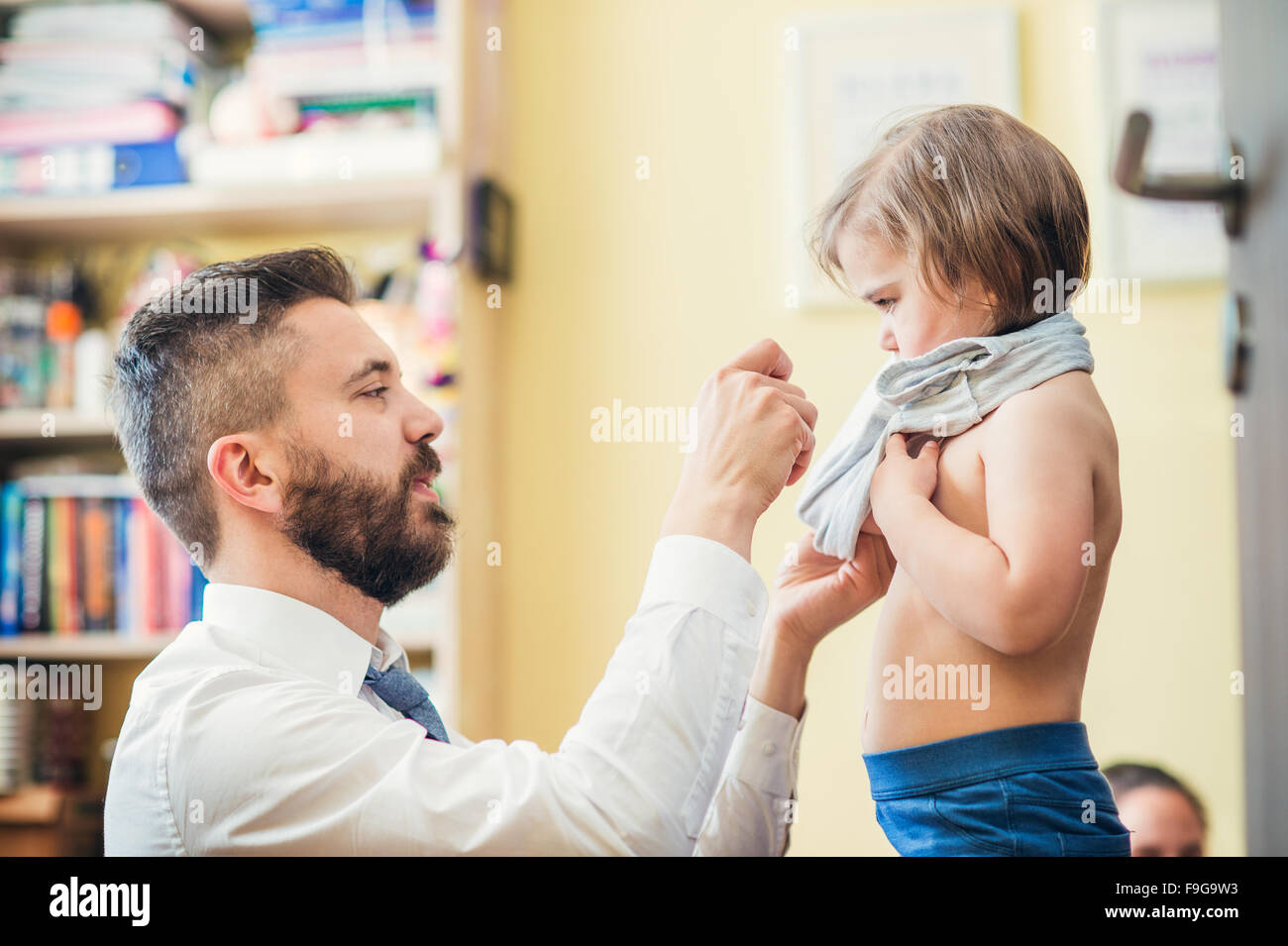 Young father getting his little daughter ready in a morning Stock Photo ...