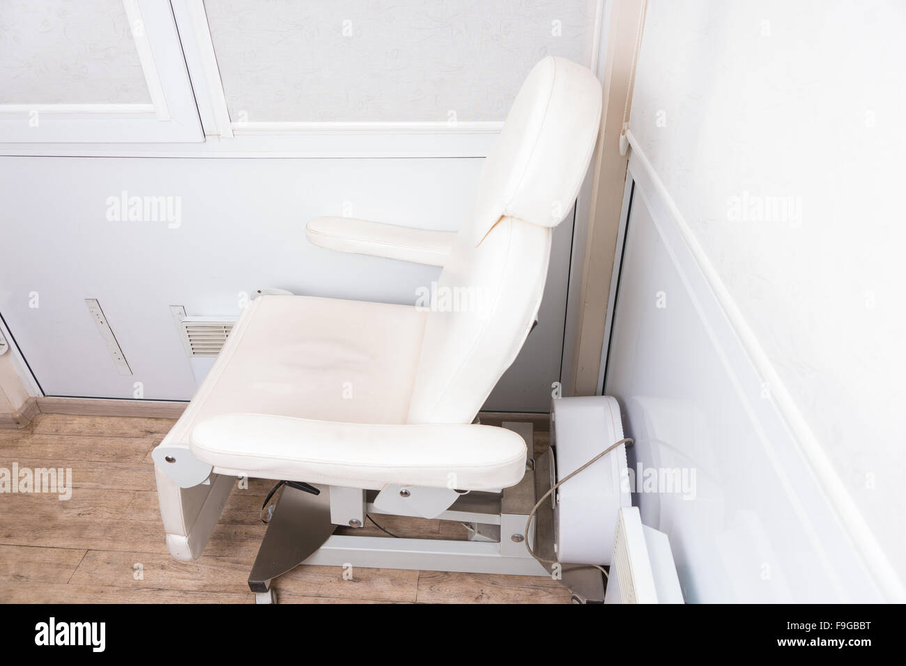 High Angle View of White Reclining Spa Chair Nestled in Corner of White ...