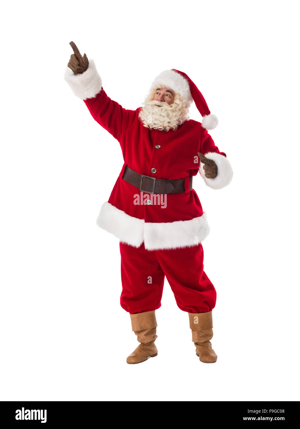 Santa Claus pointing his finger away Full-Length Portrait Stock Photo ...