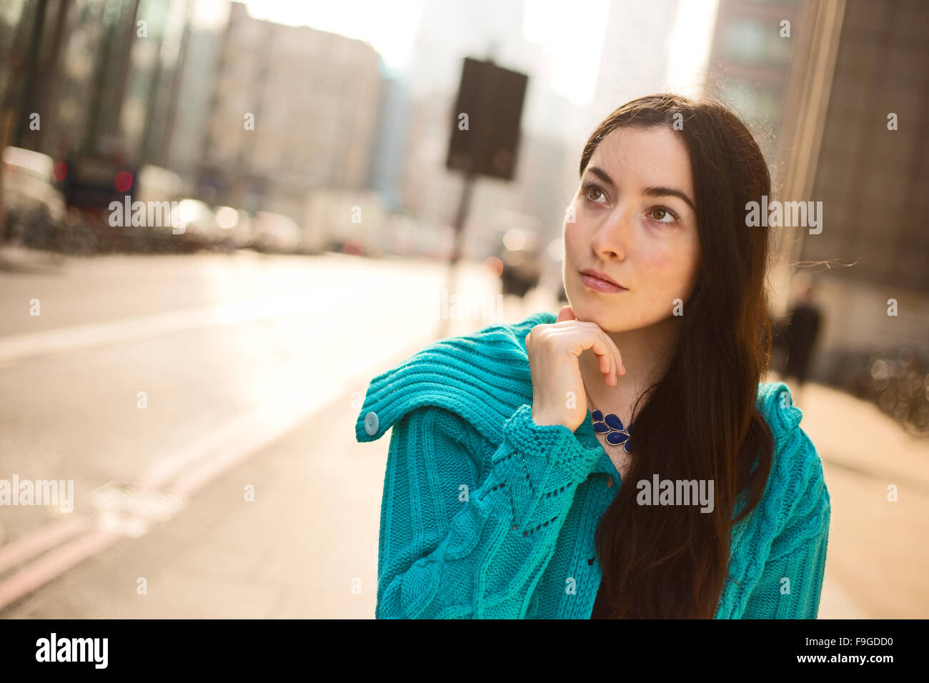 portrait of a young woman looking thoughtful Stock Photo - Alamy