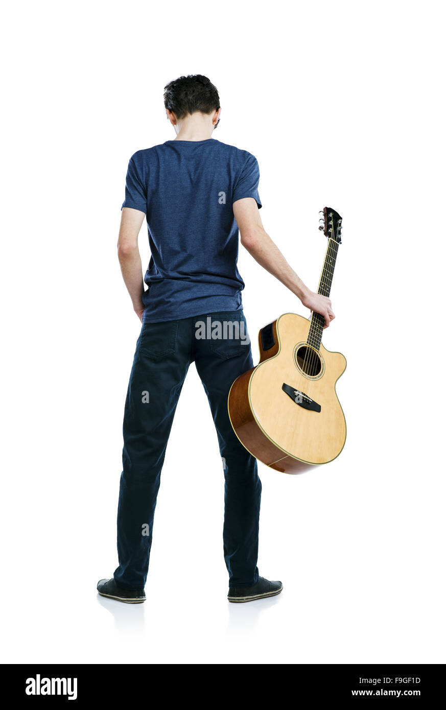 Young handsome guitar player with his instrument. Studio shot on white ...