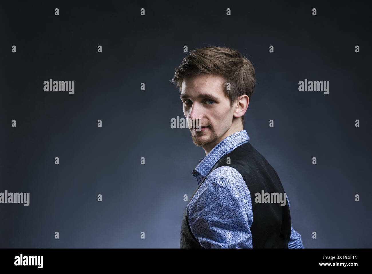 Stylish handsome young man posing. Studio shot on white background ...