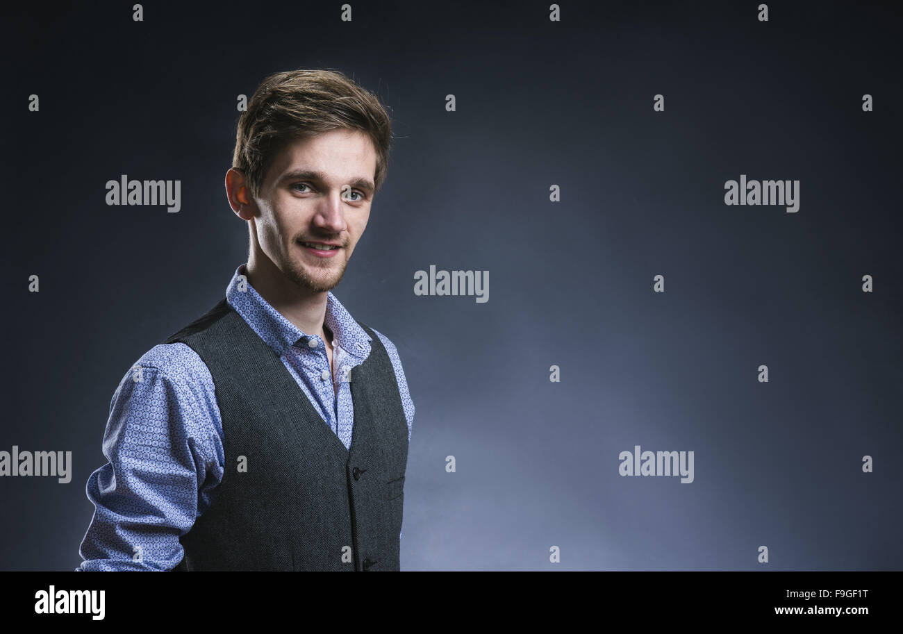 Stylish handsome young man posing. Studio shot on white background ...