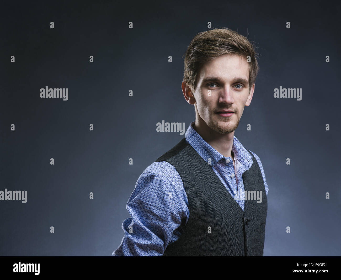 Stylish handsome young man posing. Studio shot on white background ...