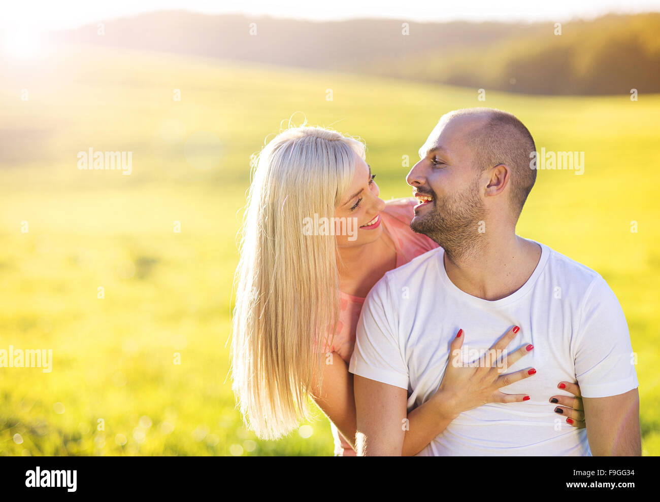 Young romantic couple hugging kiss hi-res stock photography and images ...